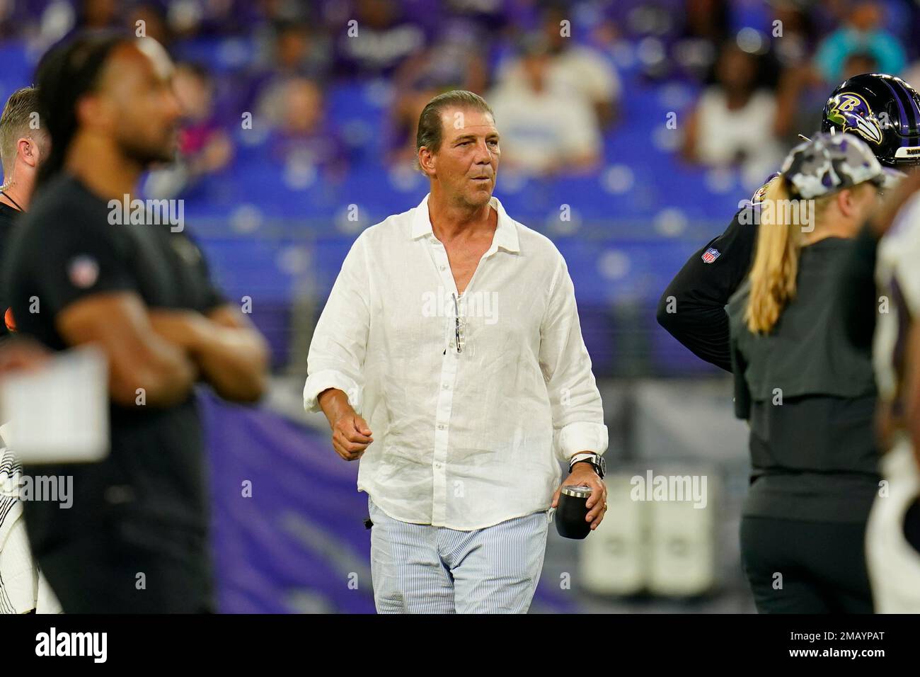 Baltimore Ravens owner Steve Bisciotti looks on as his team works out ...