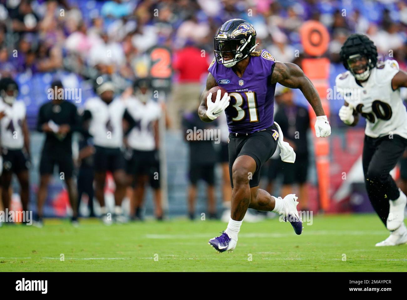Baltimore Ravens running back Corey Clement works out during the team's ...