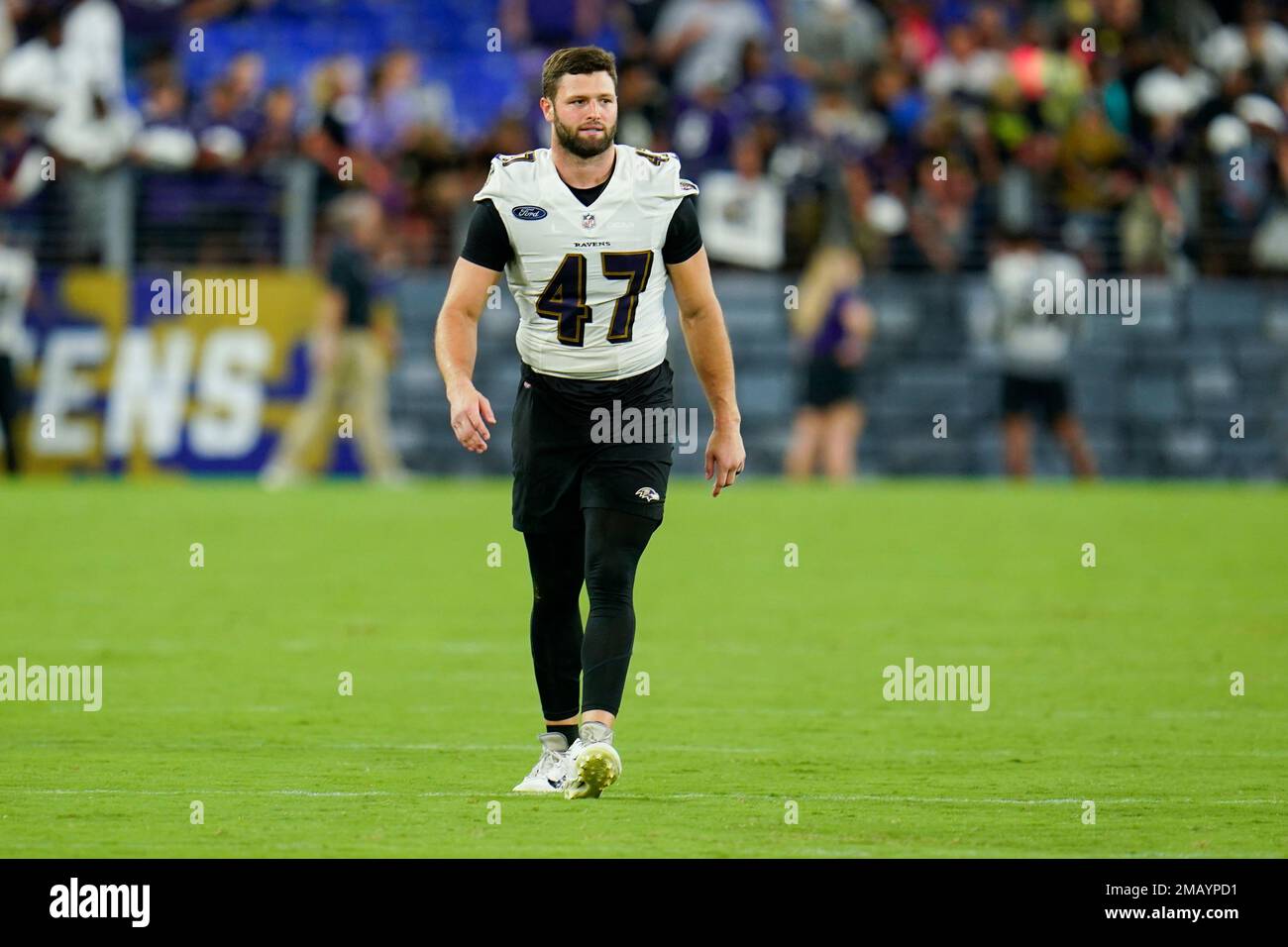 Baltimore Ravens linebacker Vince Biegel walks on the field after the ...