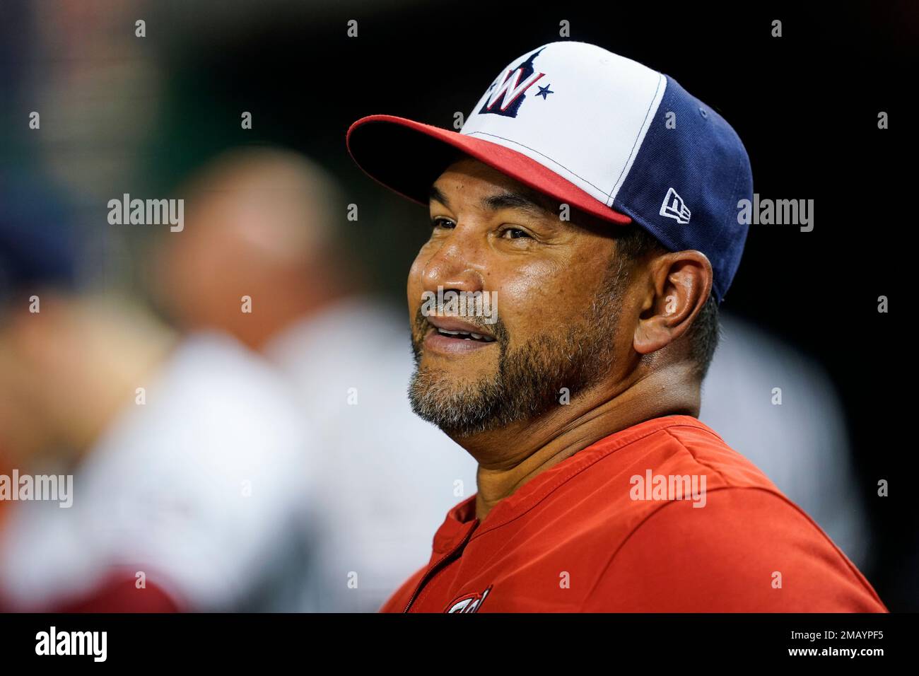 Washington Nationals manager Dave Martinez smiles in the dugout during ...