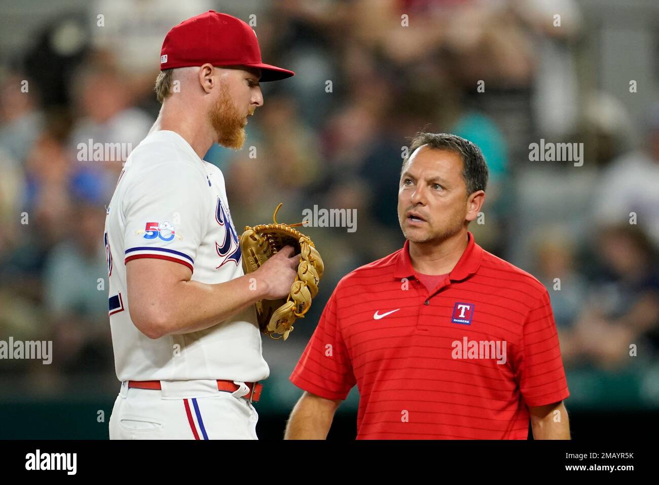 Texas Rangers starting pitcher Jon Gray talks with head athletic ...