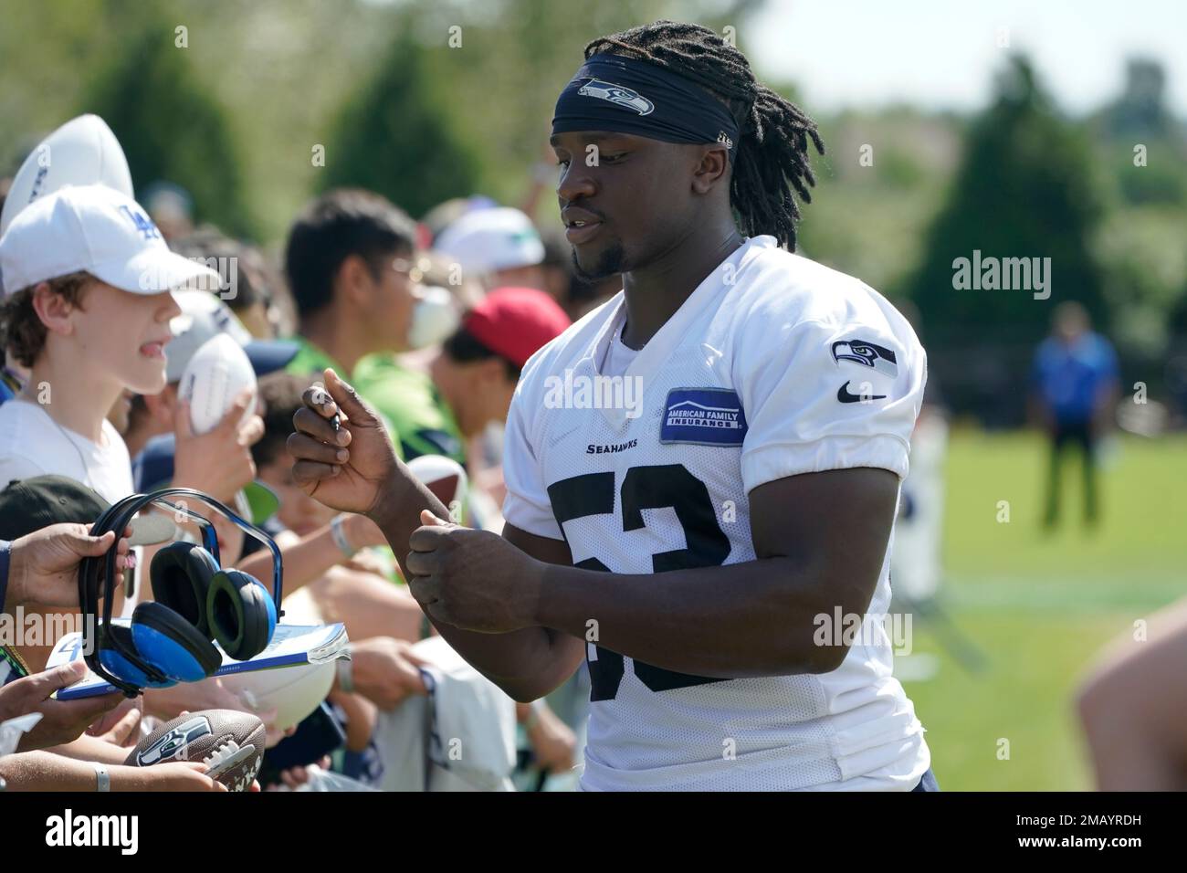 Seattle Seahawks linebacker Boye Mafe signs autographs for fans after ...