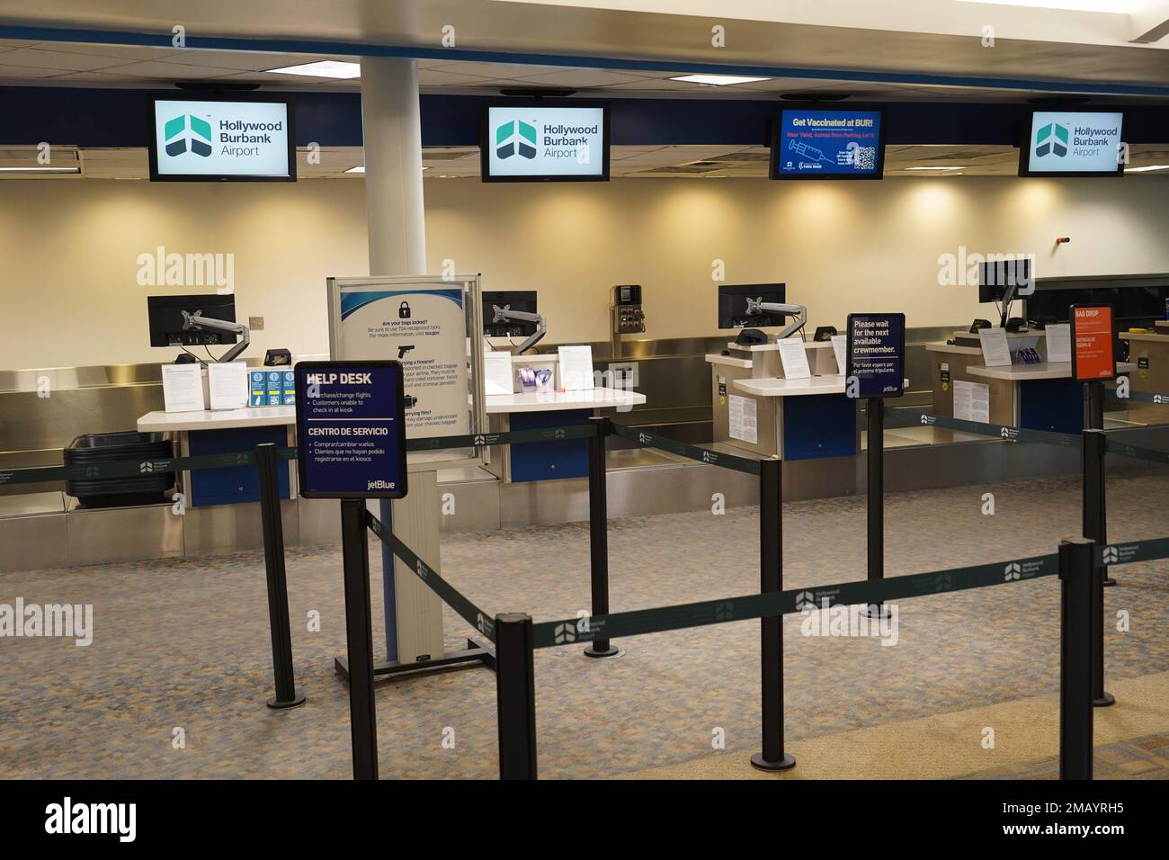 Empty ticket counter and kiosks at the Hollywood Burbank Airport ...