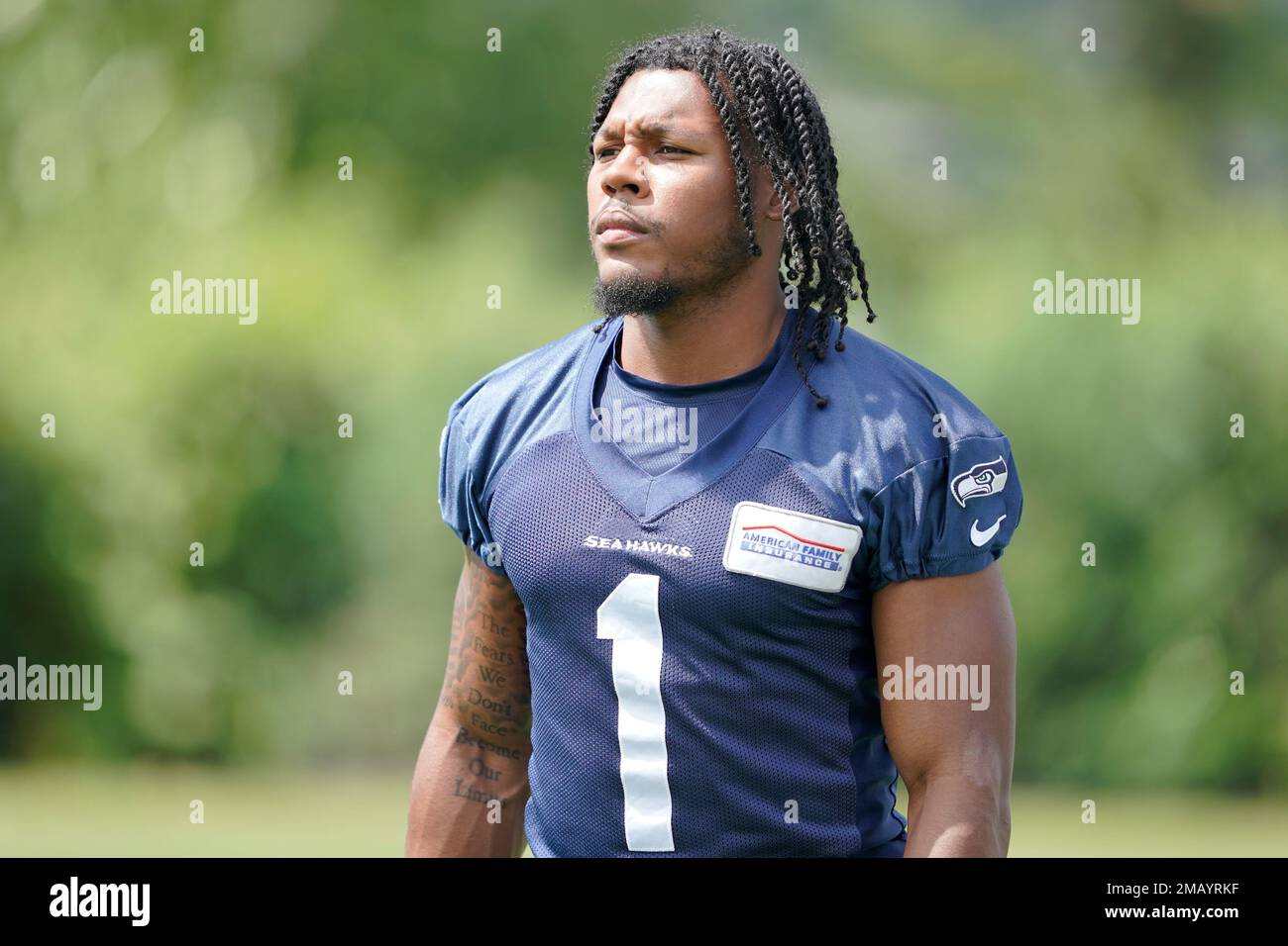 Seattle Seahawks wide receiver Dee Eskridge walks on the field during ...