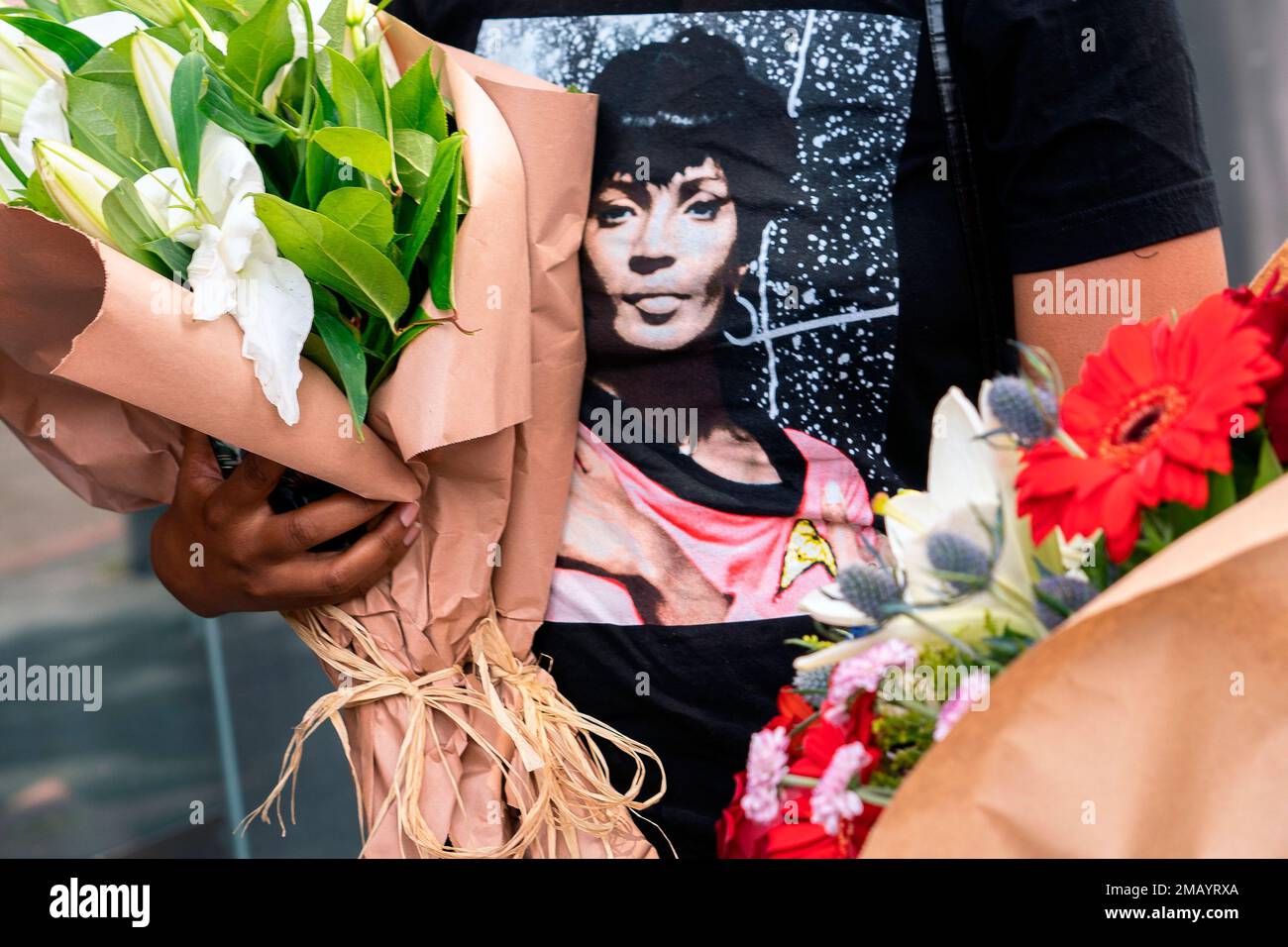 Fan Desirae Rogers brings Resurrection lilies to honor actor Nichelle ...