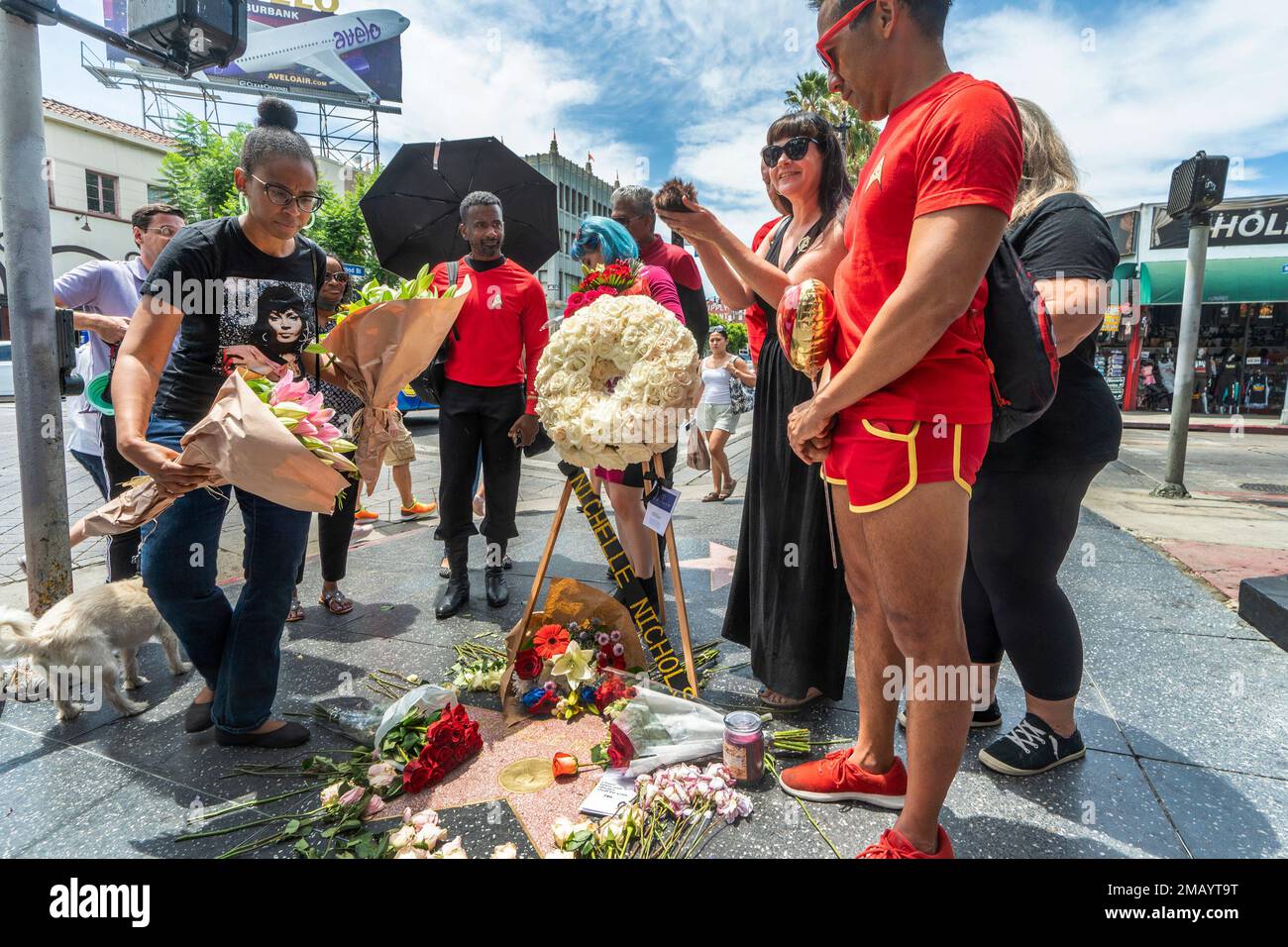 Fan Desirae Rogers, left, places Resurrection lilies to honor actor ...