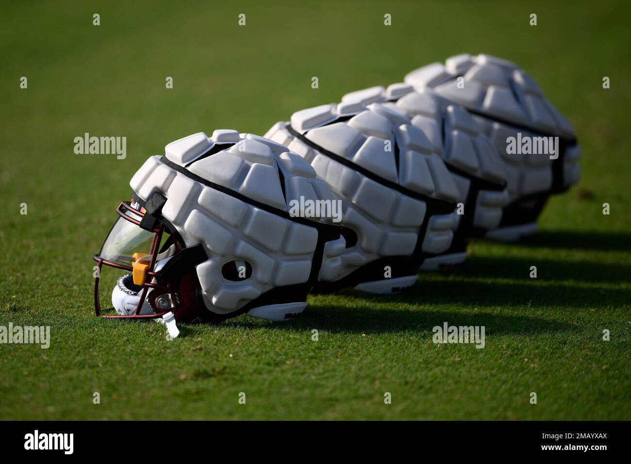 Helmets sit on the field during practice at the Washington Commanders ...
