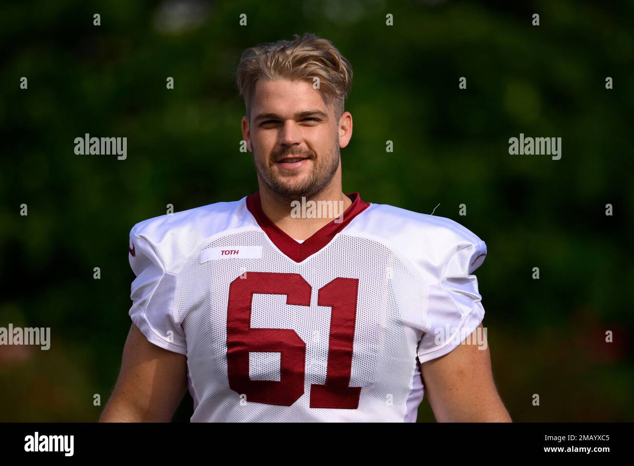Washington Commanders center Jon Toth makes his way to the field before ...