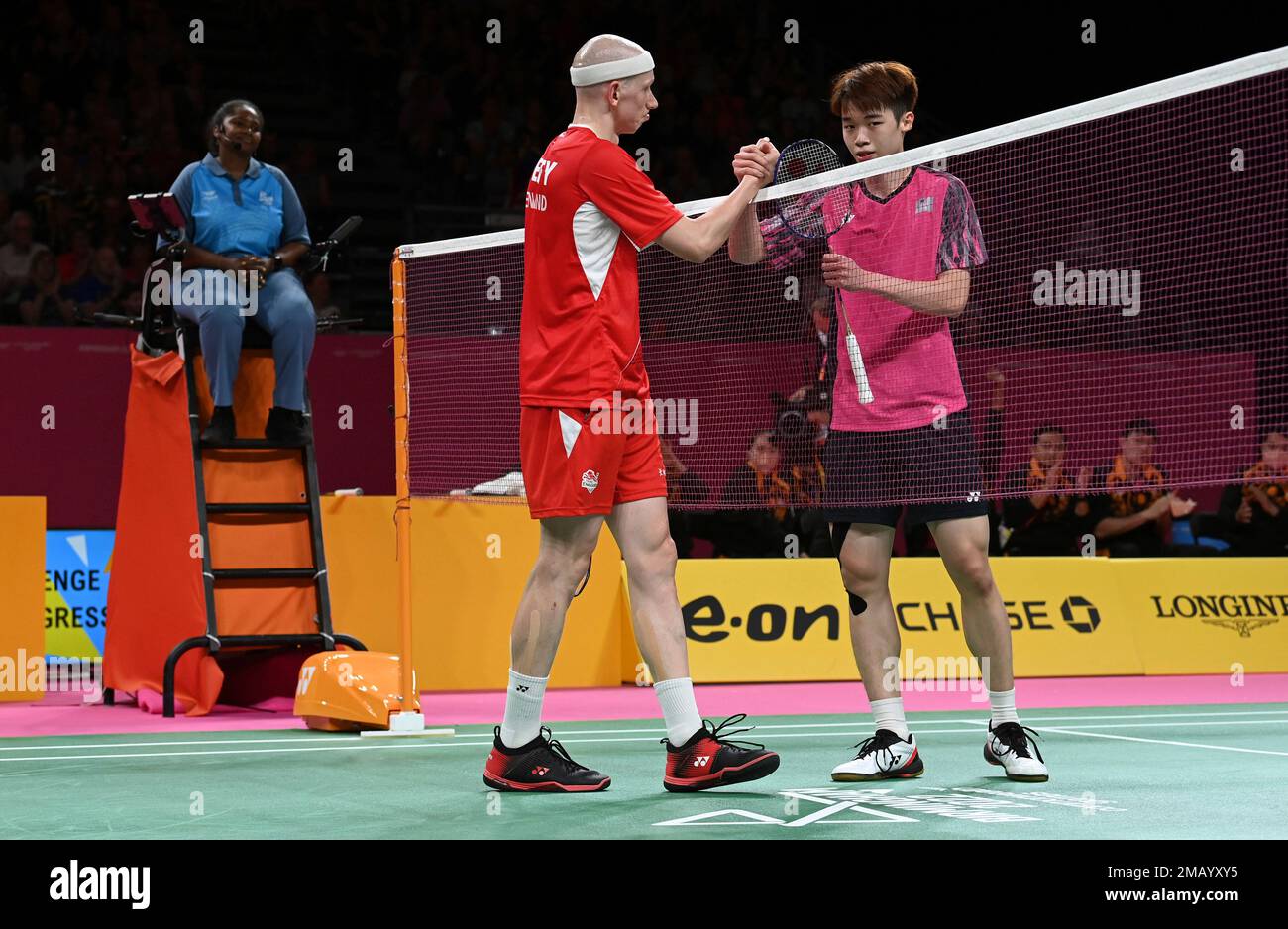 Malaysia's Mas Tze Yong NG, rightshakes hands England's Toby Penty ...