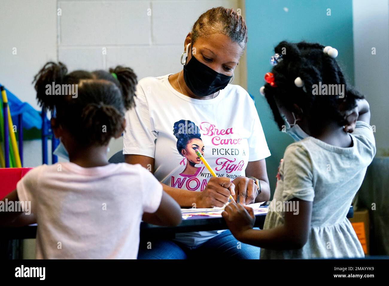 Laiah Collins, 4, left, and Charisma Edwards, 5, right, work with ...