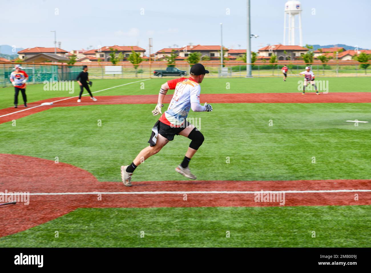 Combined teams of KATUSA and U.S. Soldiers participate in a softball ...