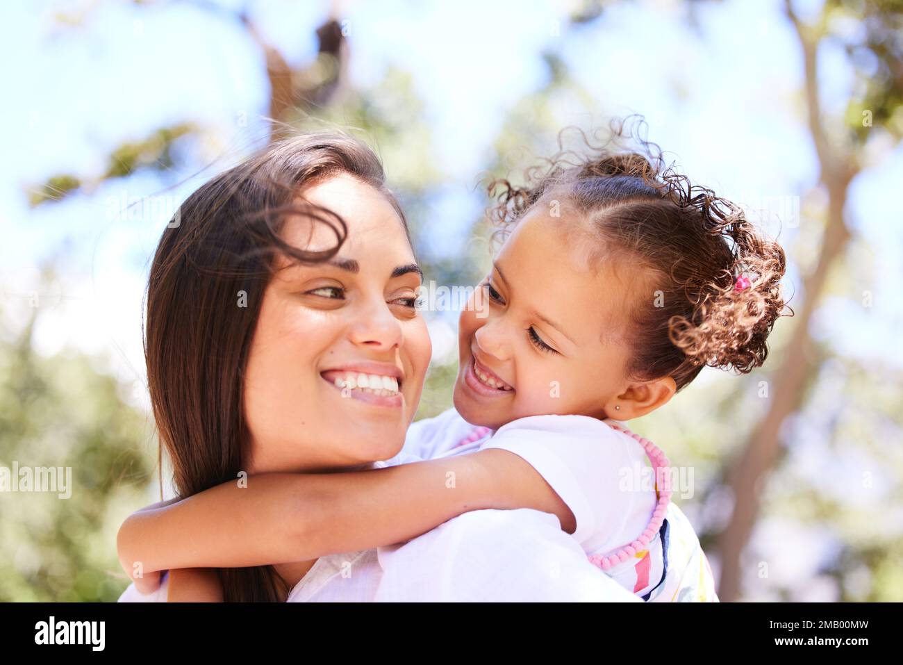 Mom carry me on your back please. a mother giving her daughter a ...