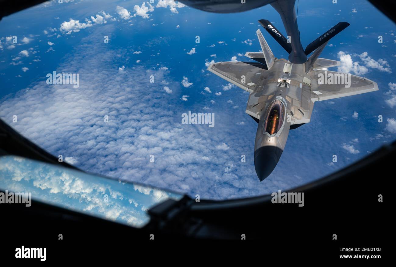 A 199th Fighter Squadron F-22A Raptor approaches a 909th Air Refueling ...