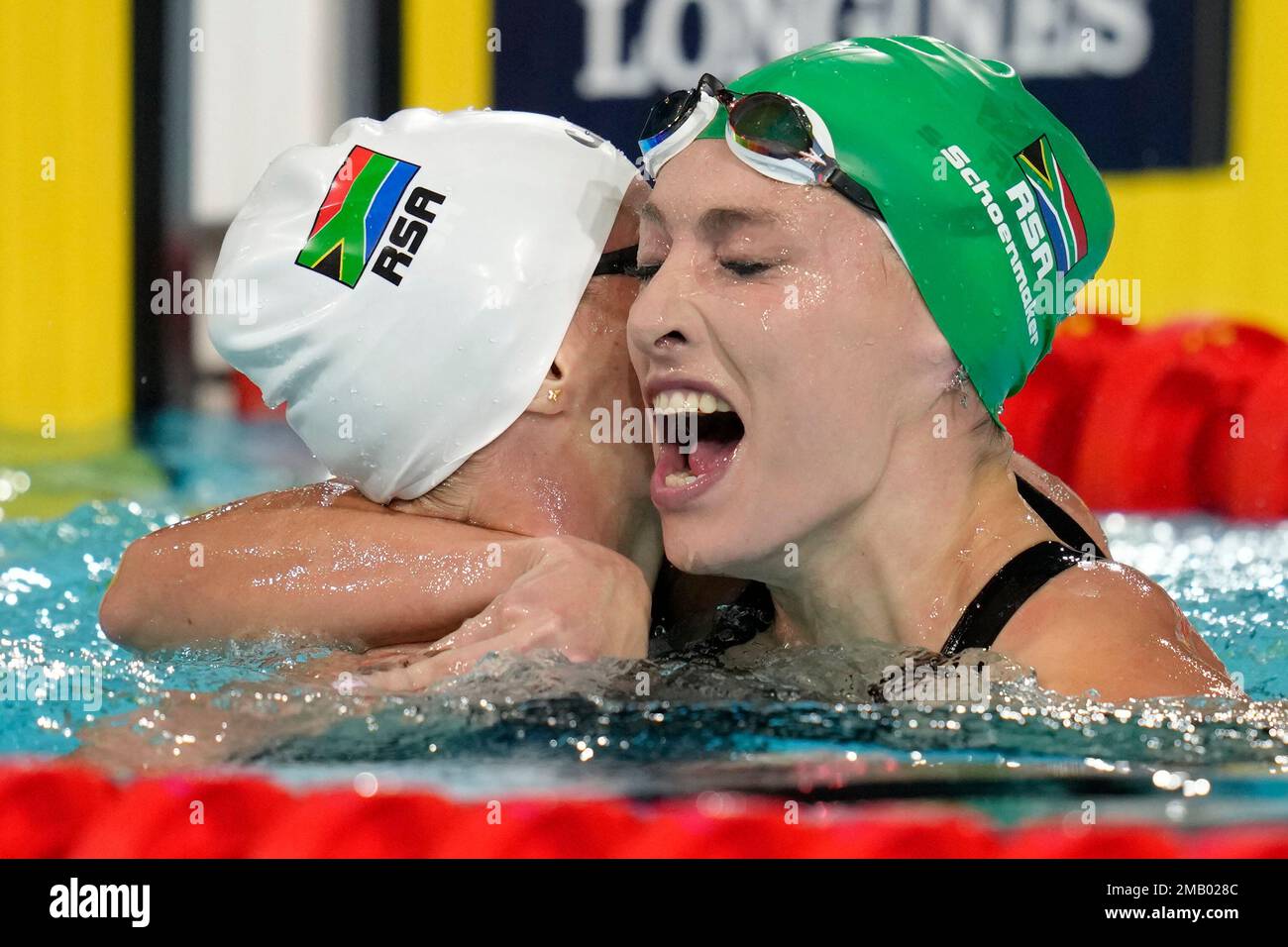 South Africa's Tatjana Schoenmaker, reacts after winning by hugging ...