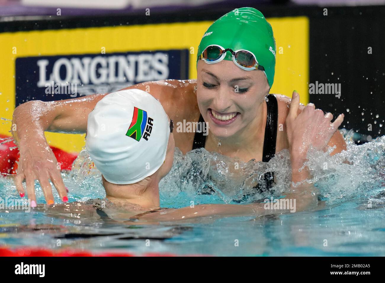 South Africa's Tatjana Schoenmaker, reacts after winning by hugging ...