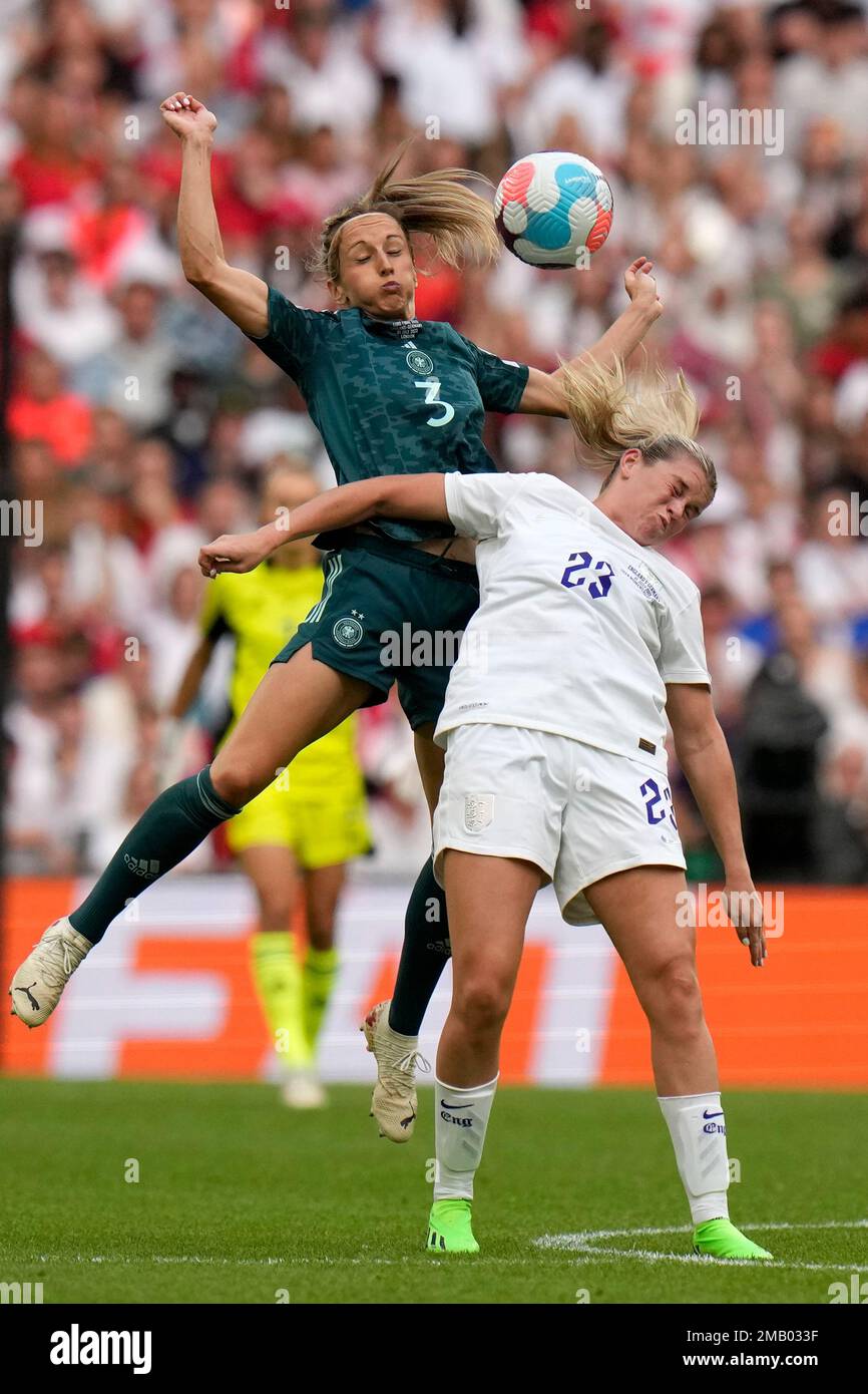 England's Alessia Russo, right, vies for the ball with Germany's ...