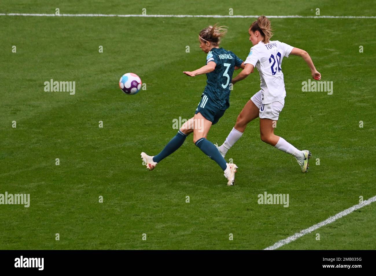 England's Ella Toone, right, scores the opening goal as Germany's ...
