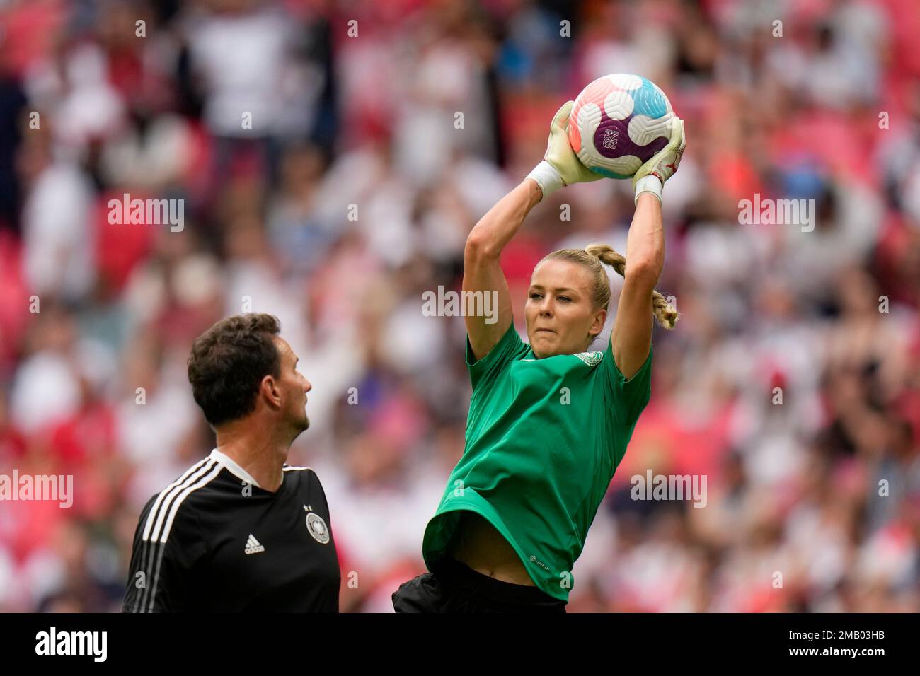 Germany's goalkeeper Merle Frohms jumps for a ball during warmup before ...