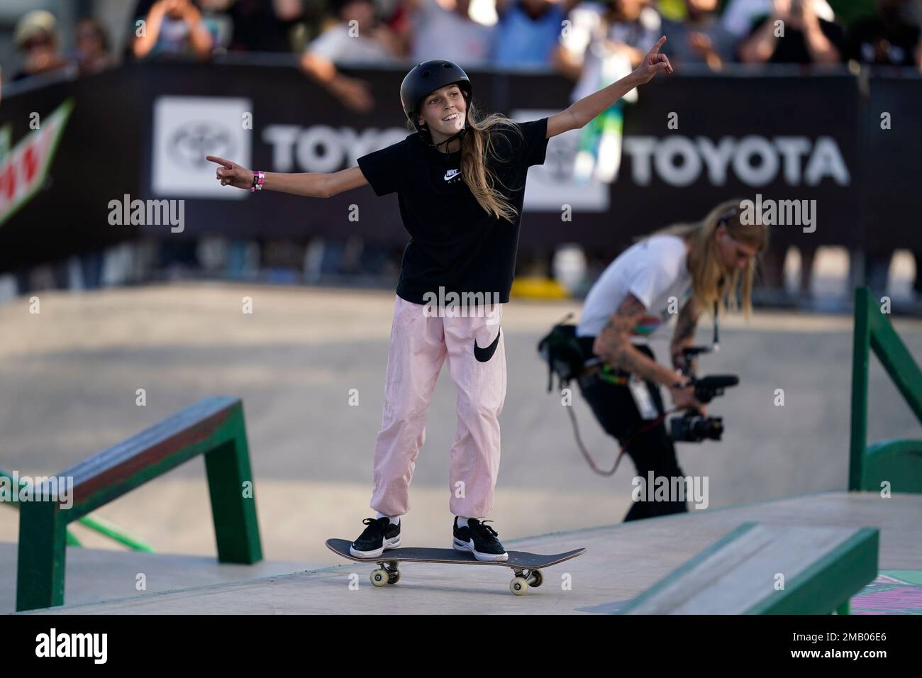 Chloe Covell, of Australia, reacts after a run in the women's street ...