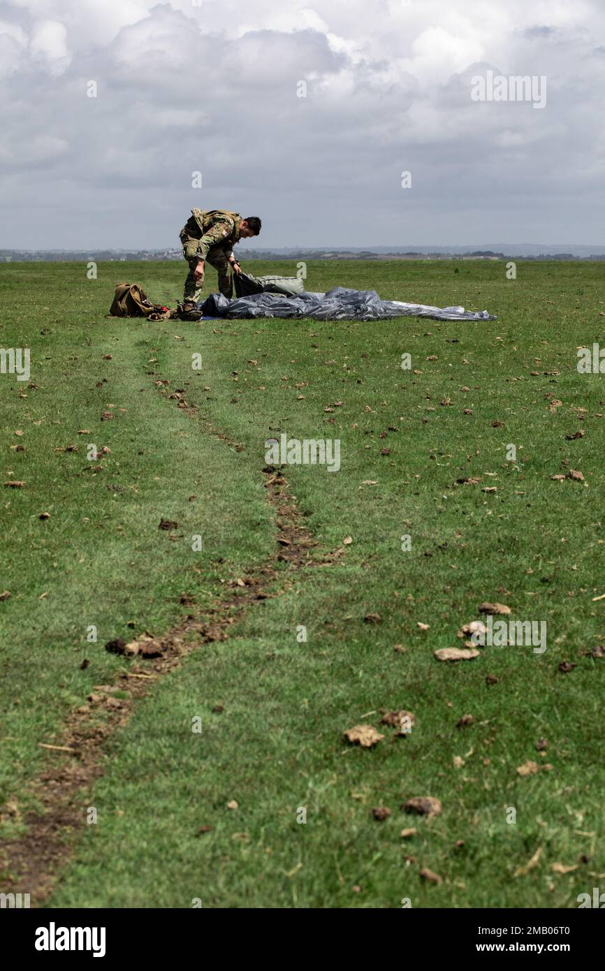 A U.S. Army Special Operations Soldier packs his parachute after ...