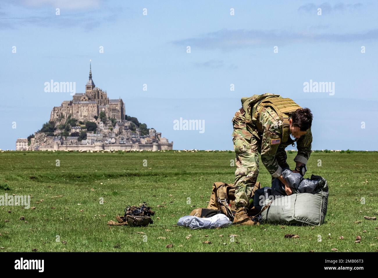 A U.S. Army Special Operations Soldier packs his parachute after ...