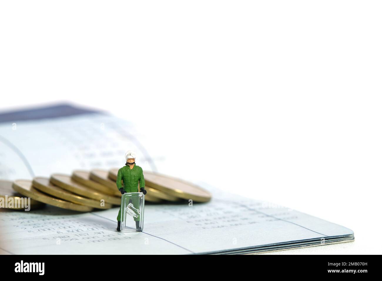 Miniature people toy figure photography. Bank account protection ...