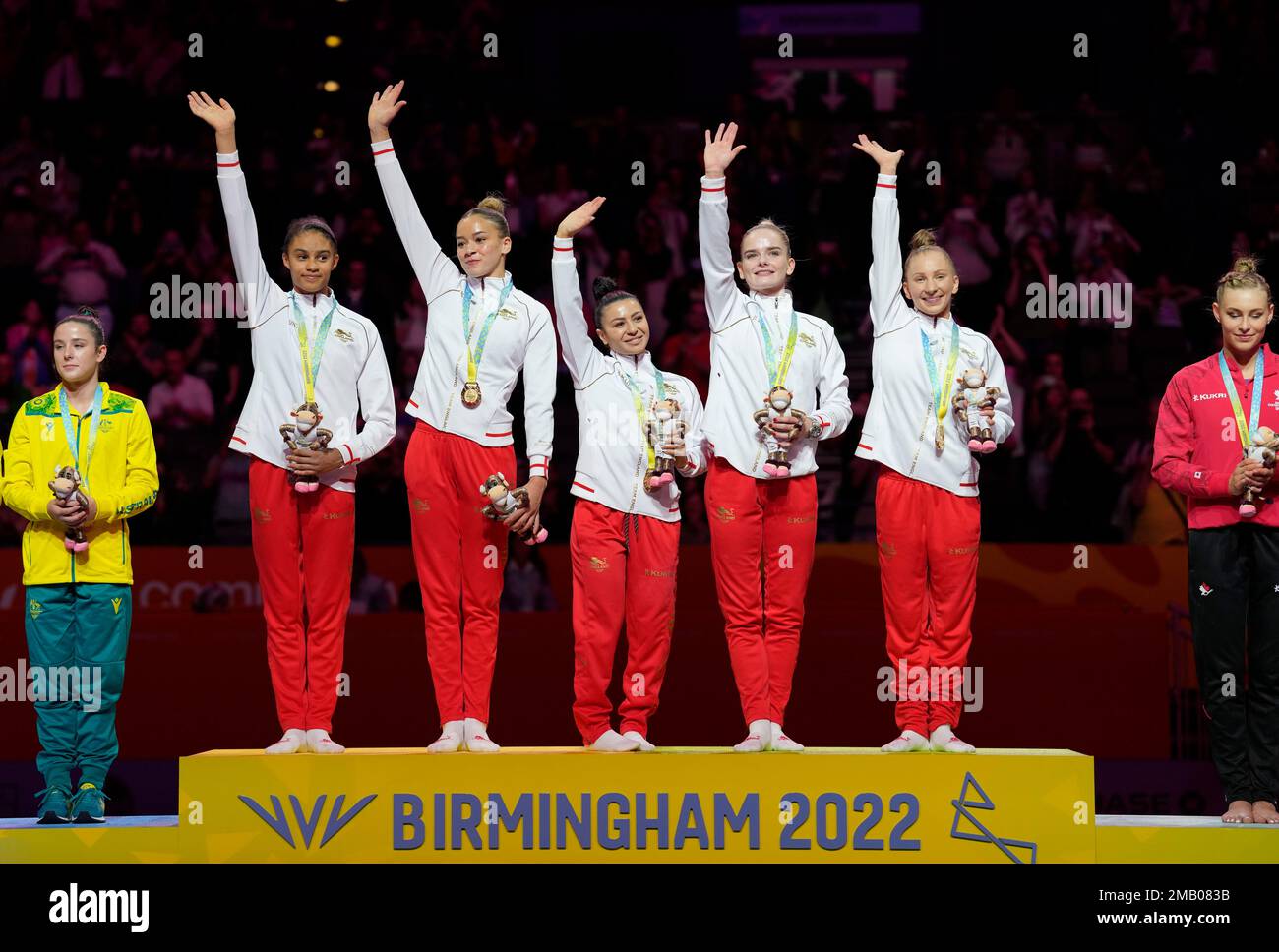 Team England celebrate on the podium with their gold medals during the ...