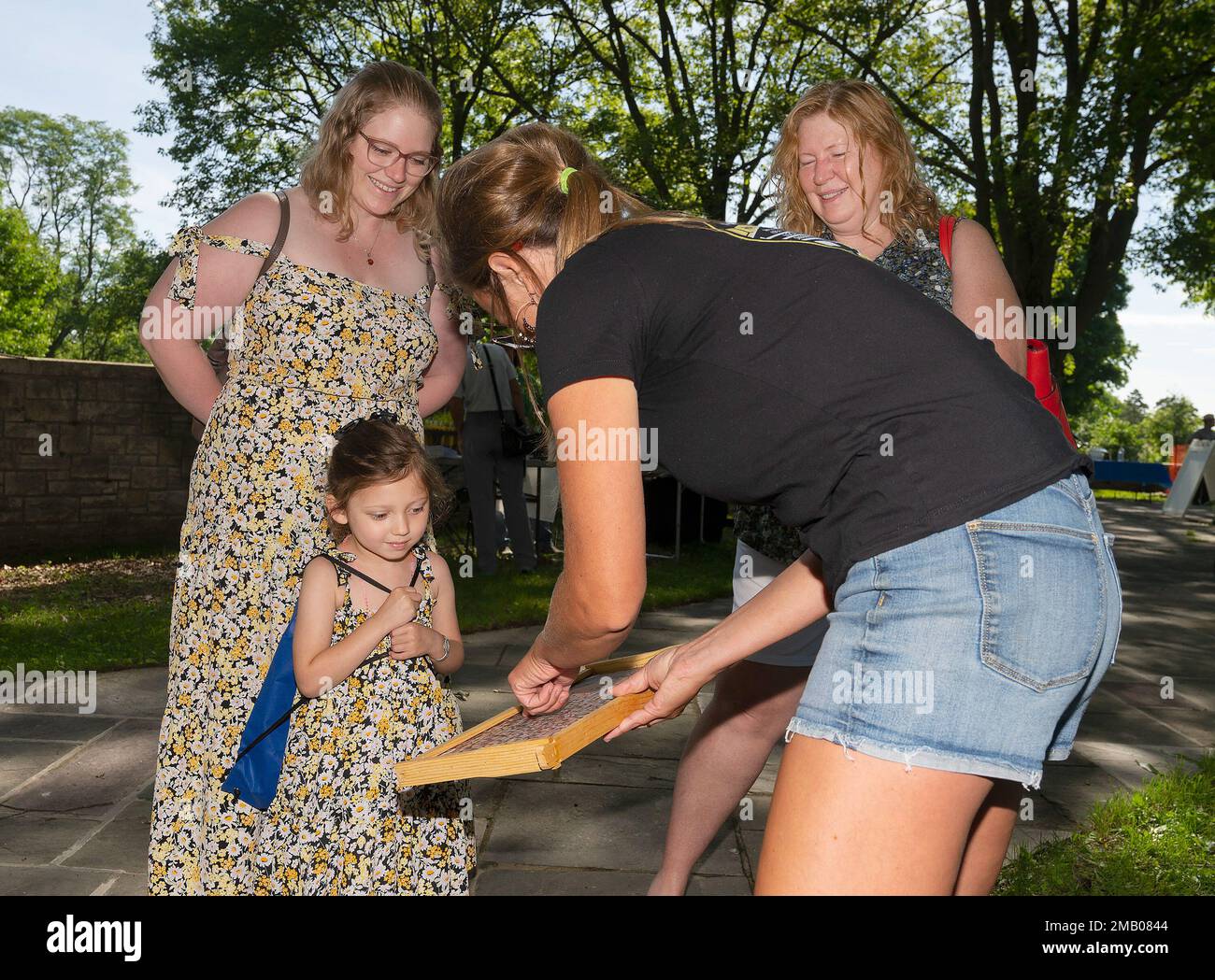 Maddie Mullins, Blue Collar Honeybees, tells Lilly Yu Blythe, 4, her ...