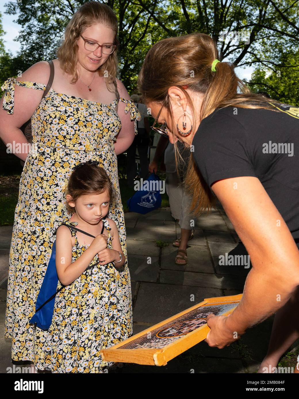 Lilly Yu Blythe, 4, seems doubtful as she listens to Maddie Mullins ...