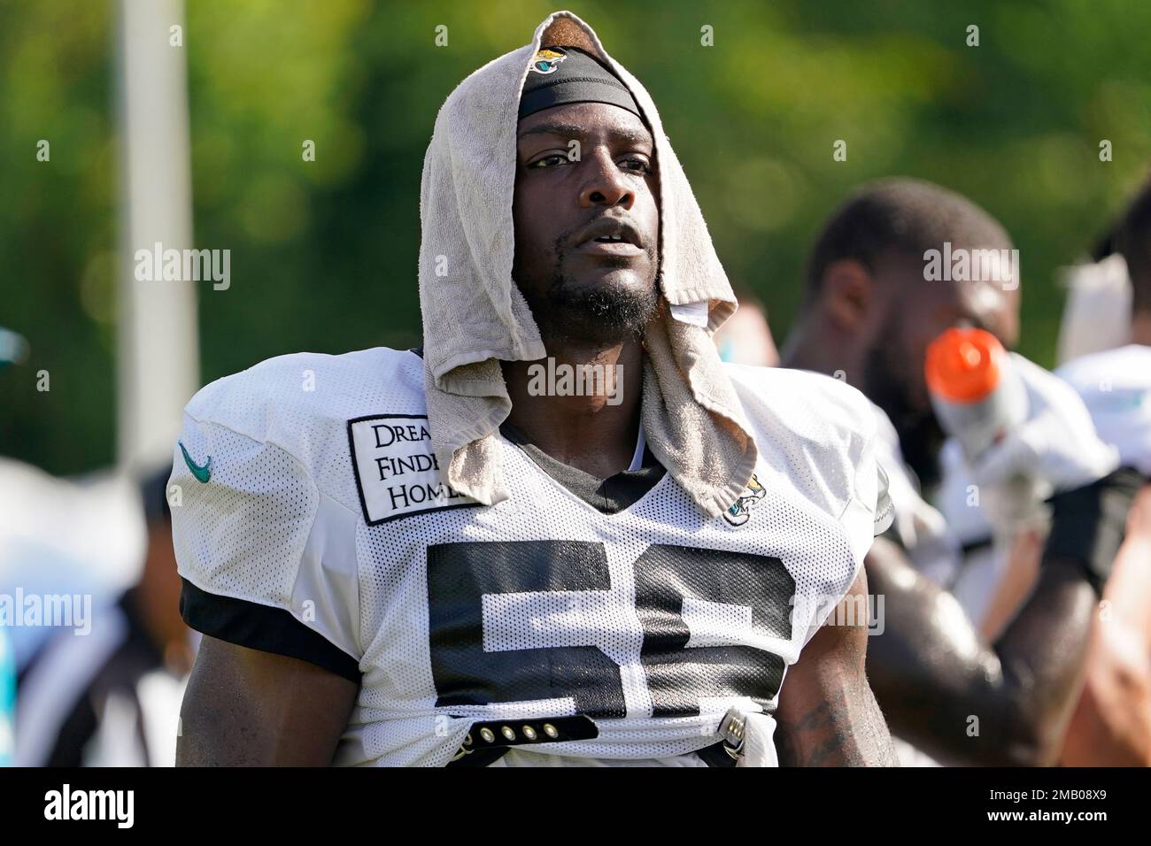 Jacksonville Jaguars linebacker Rashod Berry cools off while taking a ...
