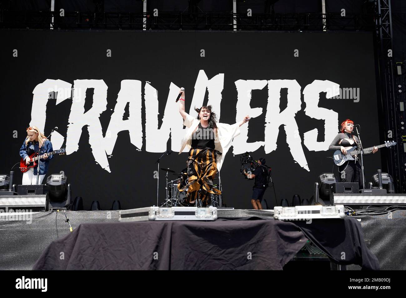 Amy Woodall, left, Holly Minto and Liv Kettle of Crawlers perform on ...