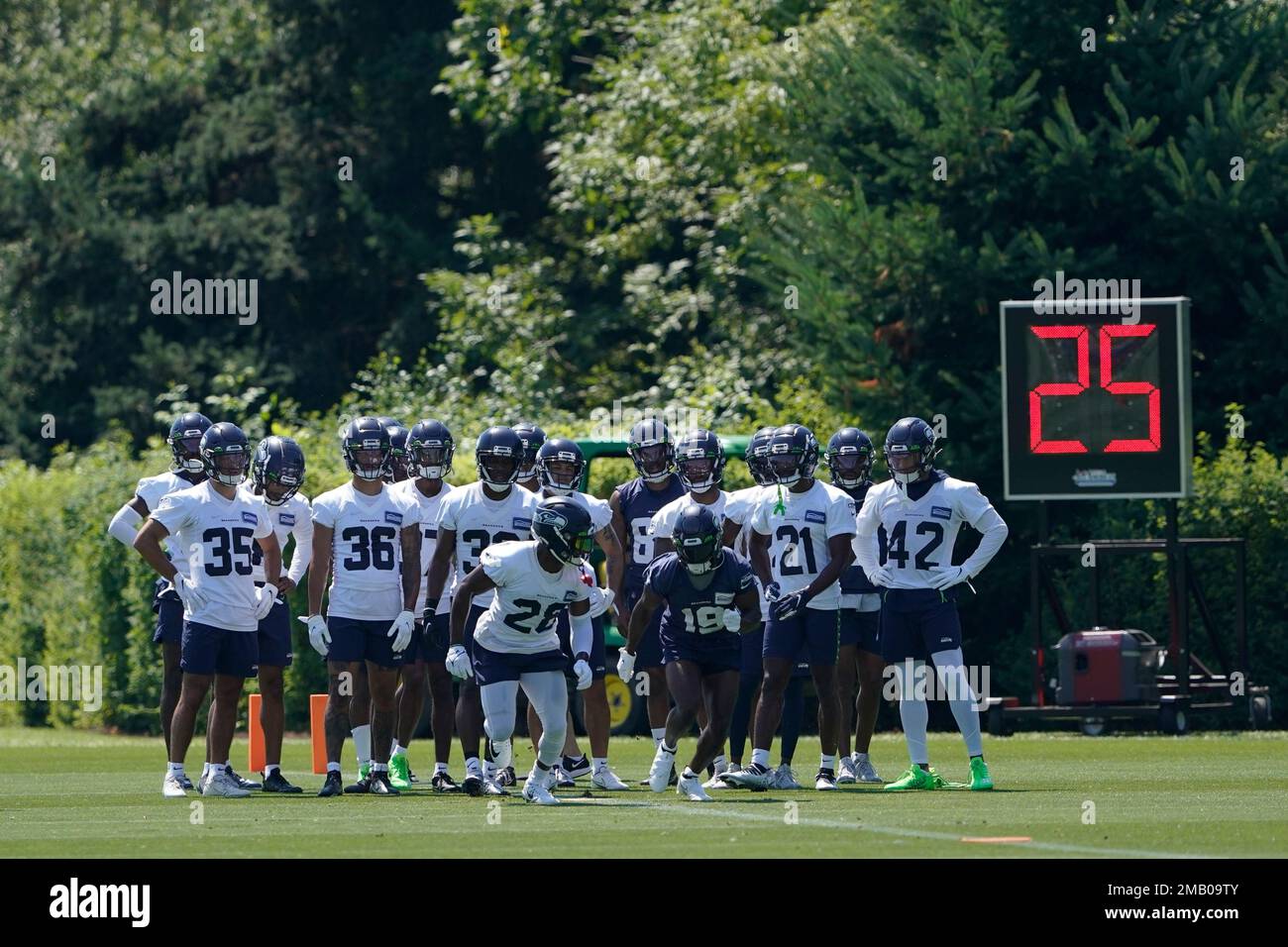 Seattle Seahawks players run a drill during NFL football practice ...