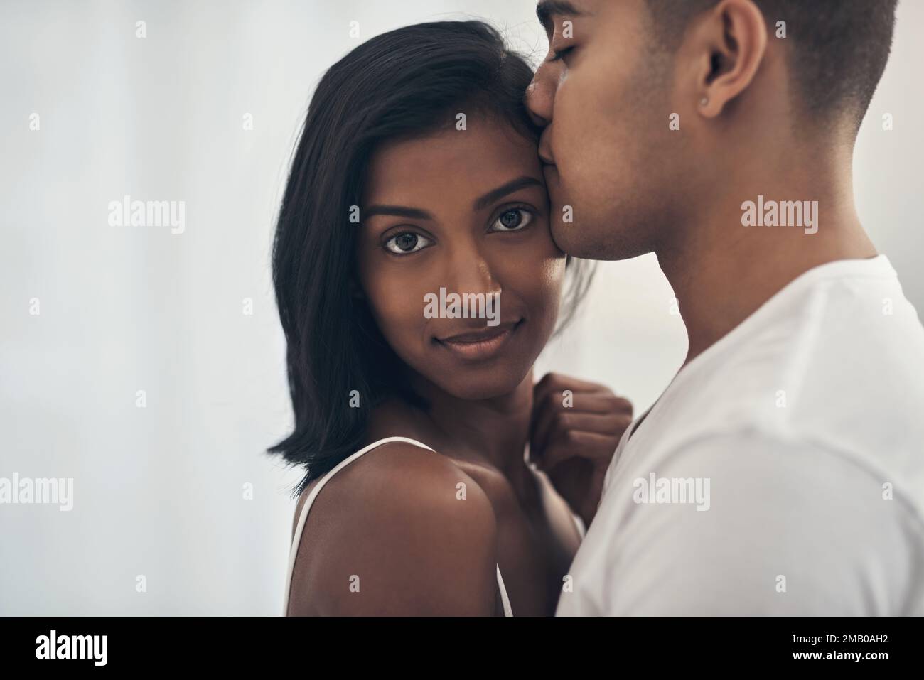 I am the luckiest guy alive. a young couple sharing an intimate moment ...