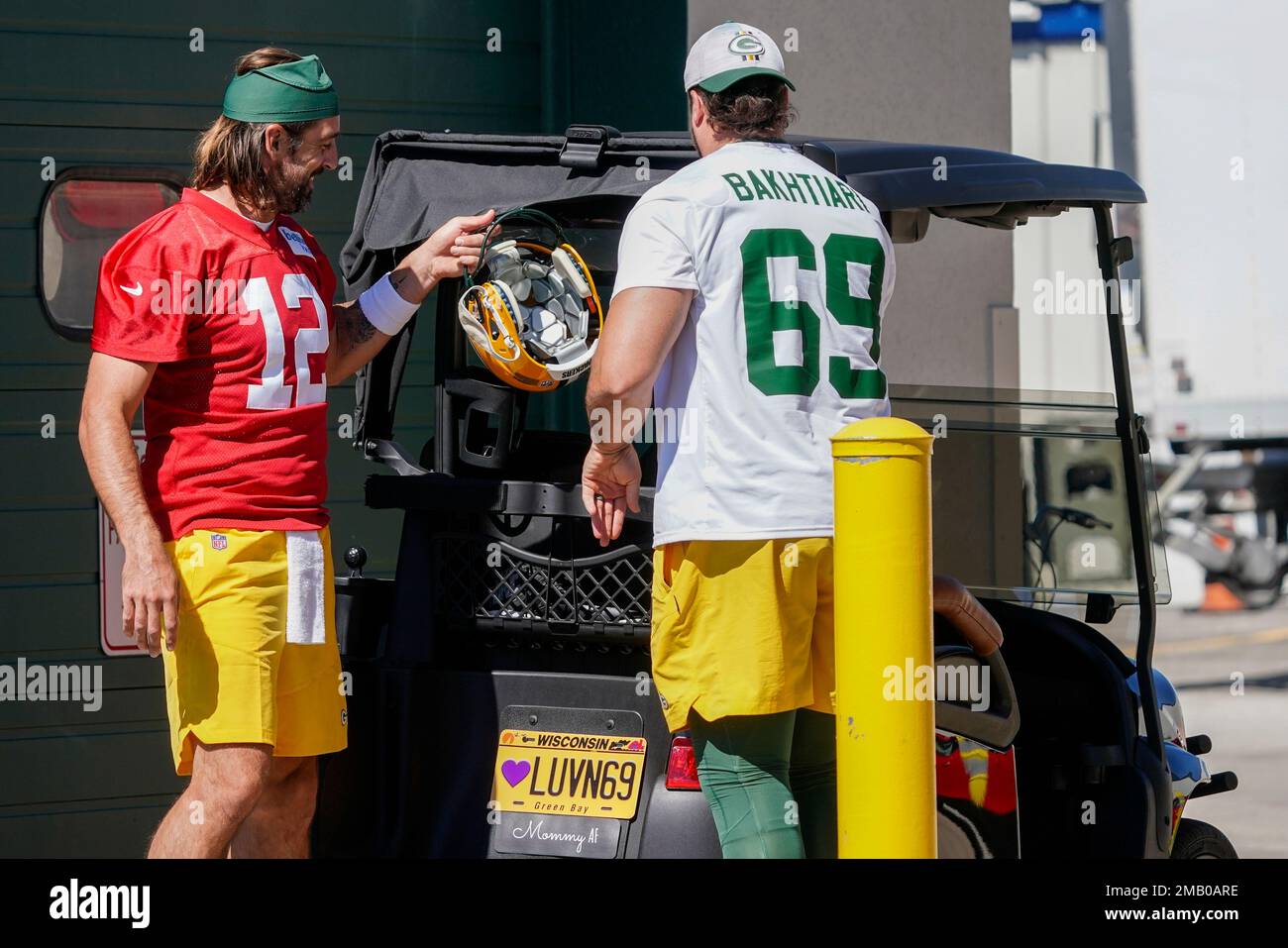Green Bay Packers' Aaron Rodgers and David Bakhtiari arrive on a golf ...