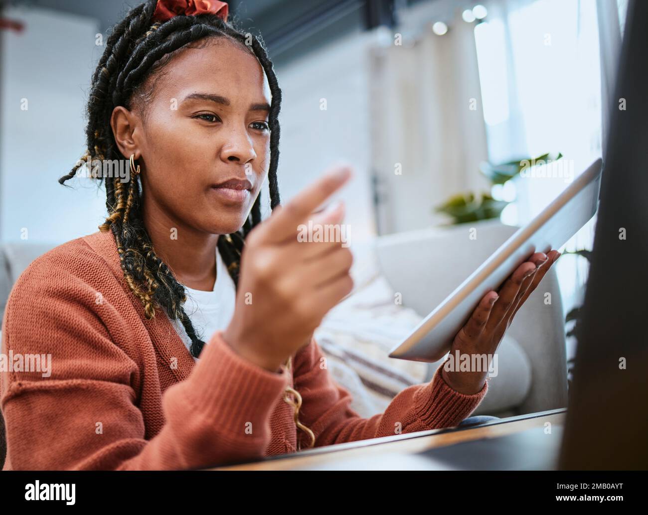 Black woman, tablet and reading on laptop for online email ...