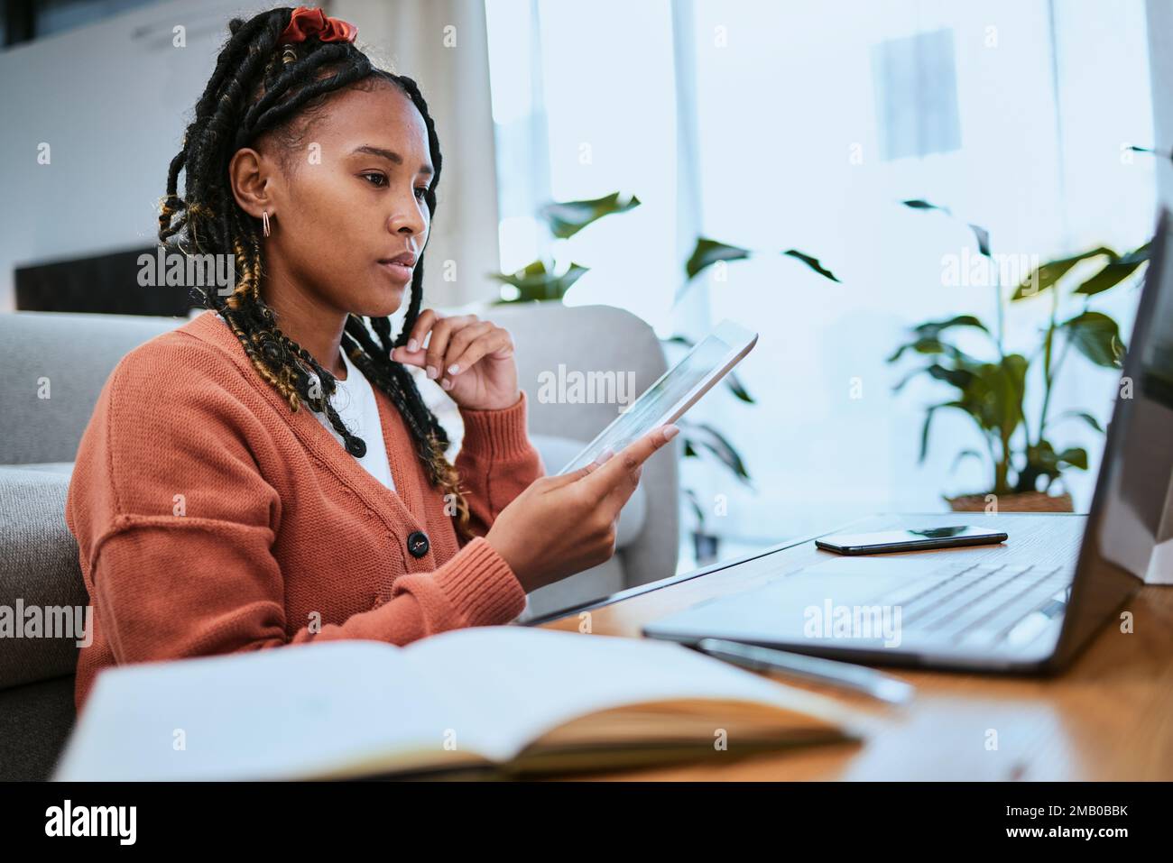 Black woman, tablet and student reading on laptop for online email ...