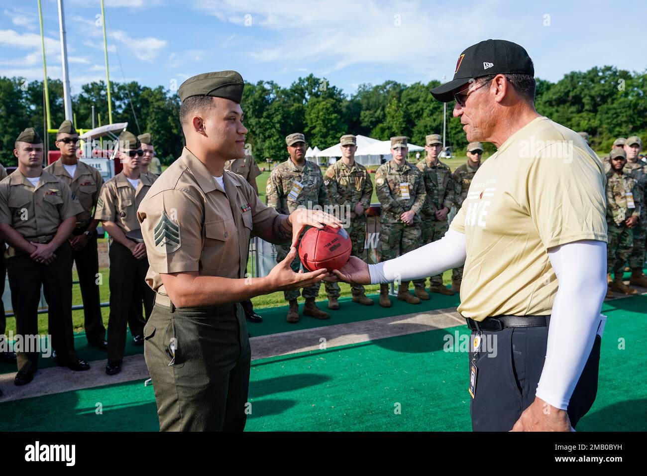 U.S. Marine Corps Sgt. Dorian Roblin, with HMX-1, receives a game ball ...