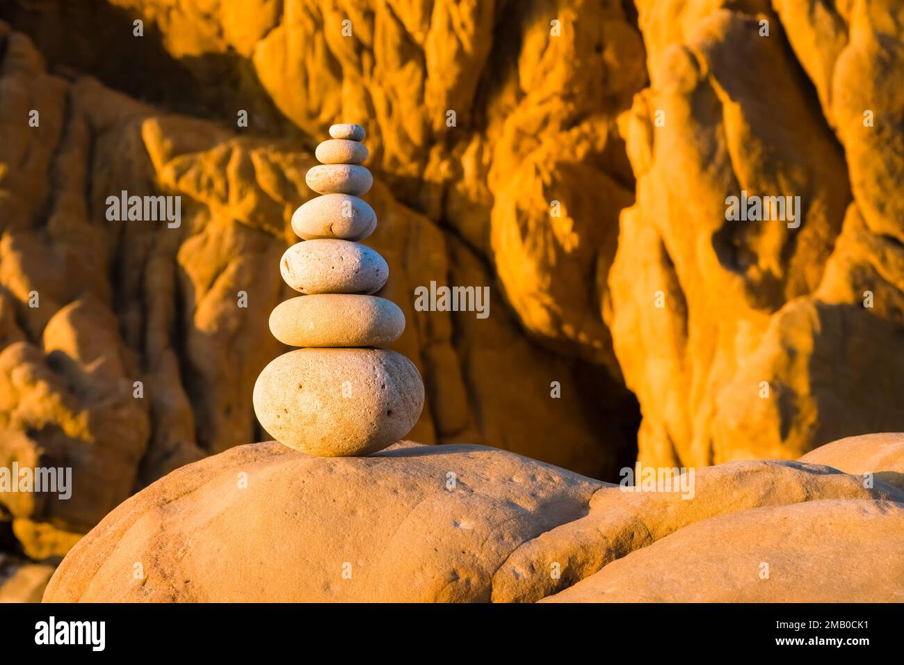A well-balanced cairn on the beach of the small town of Castle di Tusa ...