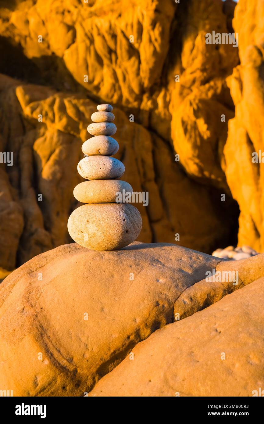 A well-balanced cairn on the beach of the small town of Castle di Tusa ...