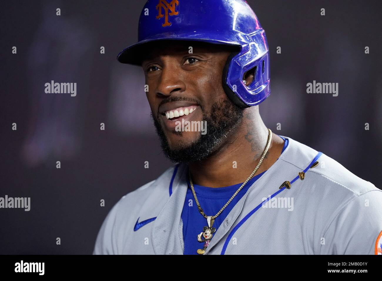 New York Mets' Starling Marte smiles in the dugout after hitting a home ...