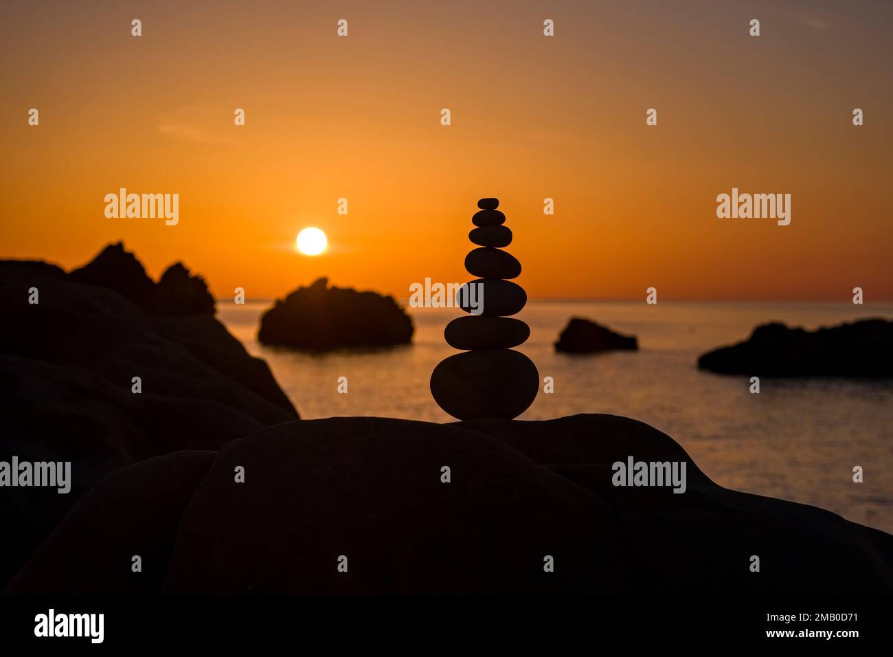 A well-balanced cairn on the beach of the small town of Castle di Tusa ...
