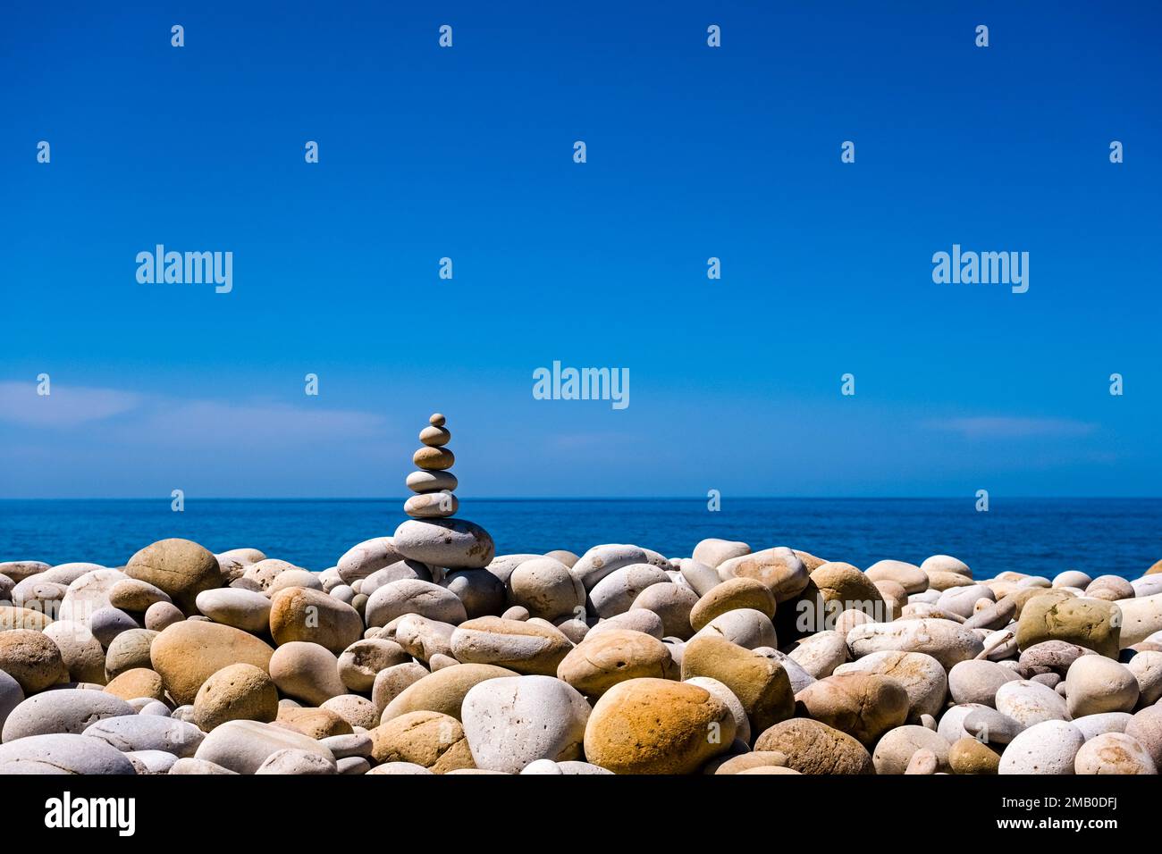 A well-balanced cairn on the beach of the small town of Castle di Tusa ...