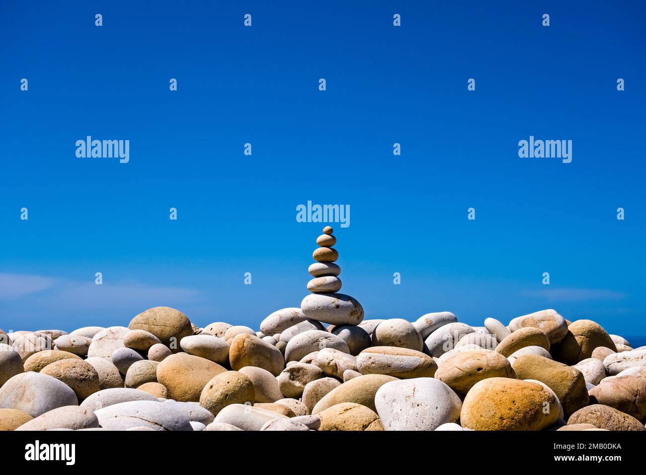 A well-balanced cairn on the beach of the small town of Castle di Tusa ...