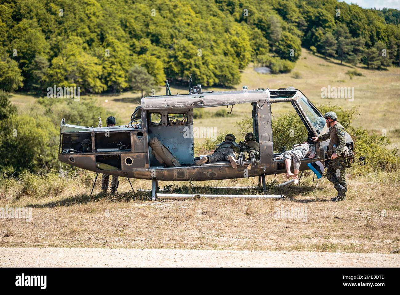 Estonian soldiers identify targets from a downed UH-60 Blackhawk during ...