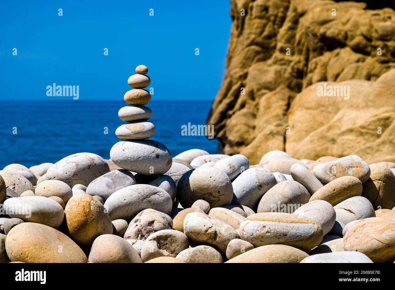 A well-balanced cairn on the beach of the small town of Castle di Tusa ...