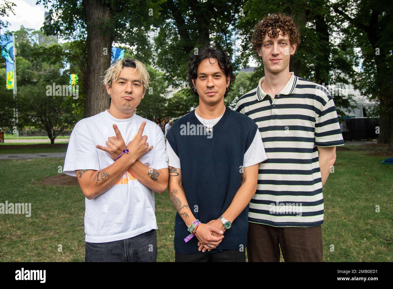 Lachlan Caskey, left, Sean Caskey, and Michael Sloane of Last Dinosaurs pose on day two of the ...