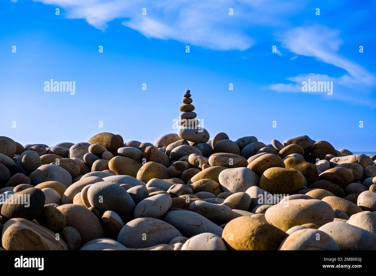 A well-balanced cairn on the beach of the small town of Castle di Tusa ...