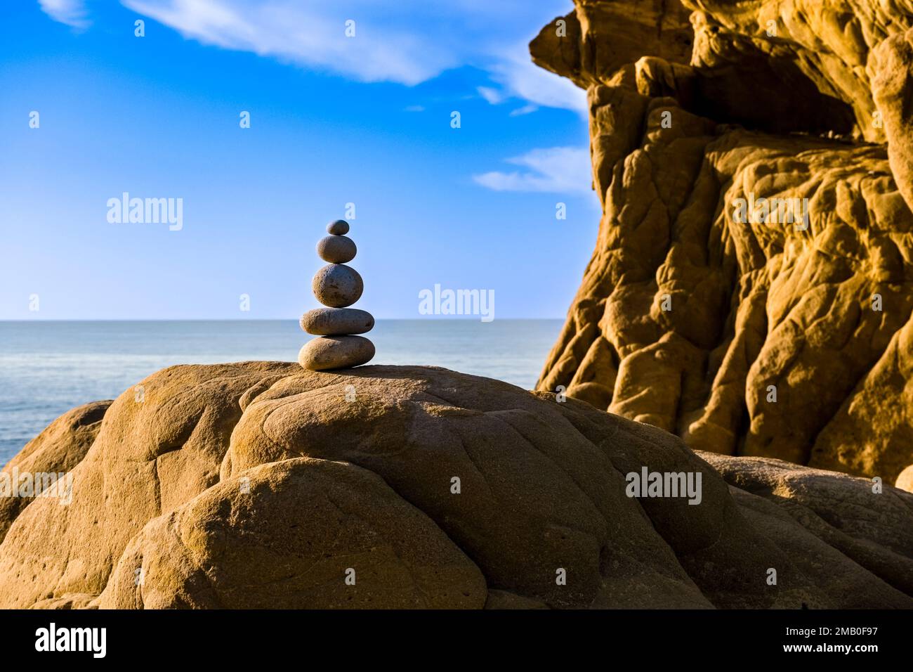 A well-balanced cairn on the beach of the small town of Castle di Tusa ...