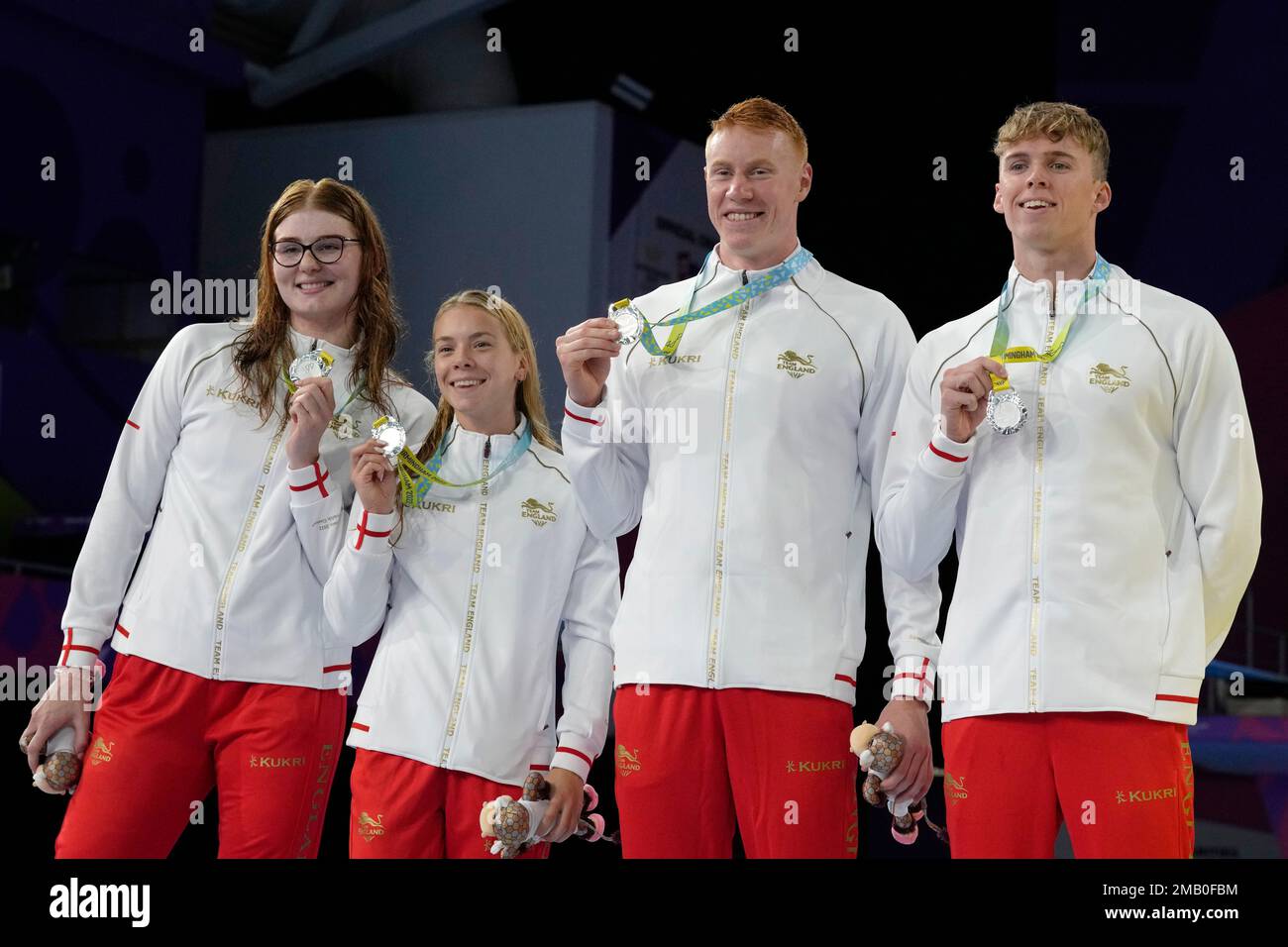 Team England swimmers pose with their medals after finishing second in ...