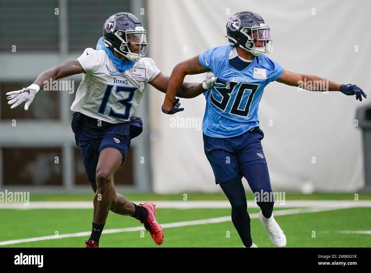 Tennessee Titans wide receiver Racey McMath (13) is defended by ...